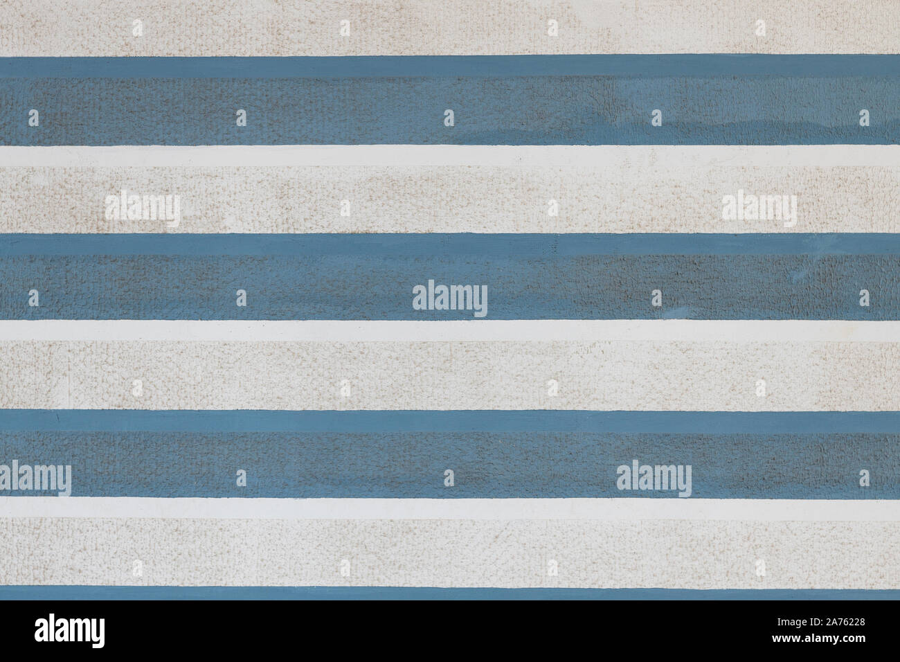 Front view of blue and white striped wall surface. Stripes on parget or ...