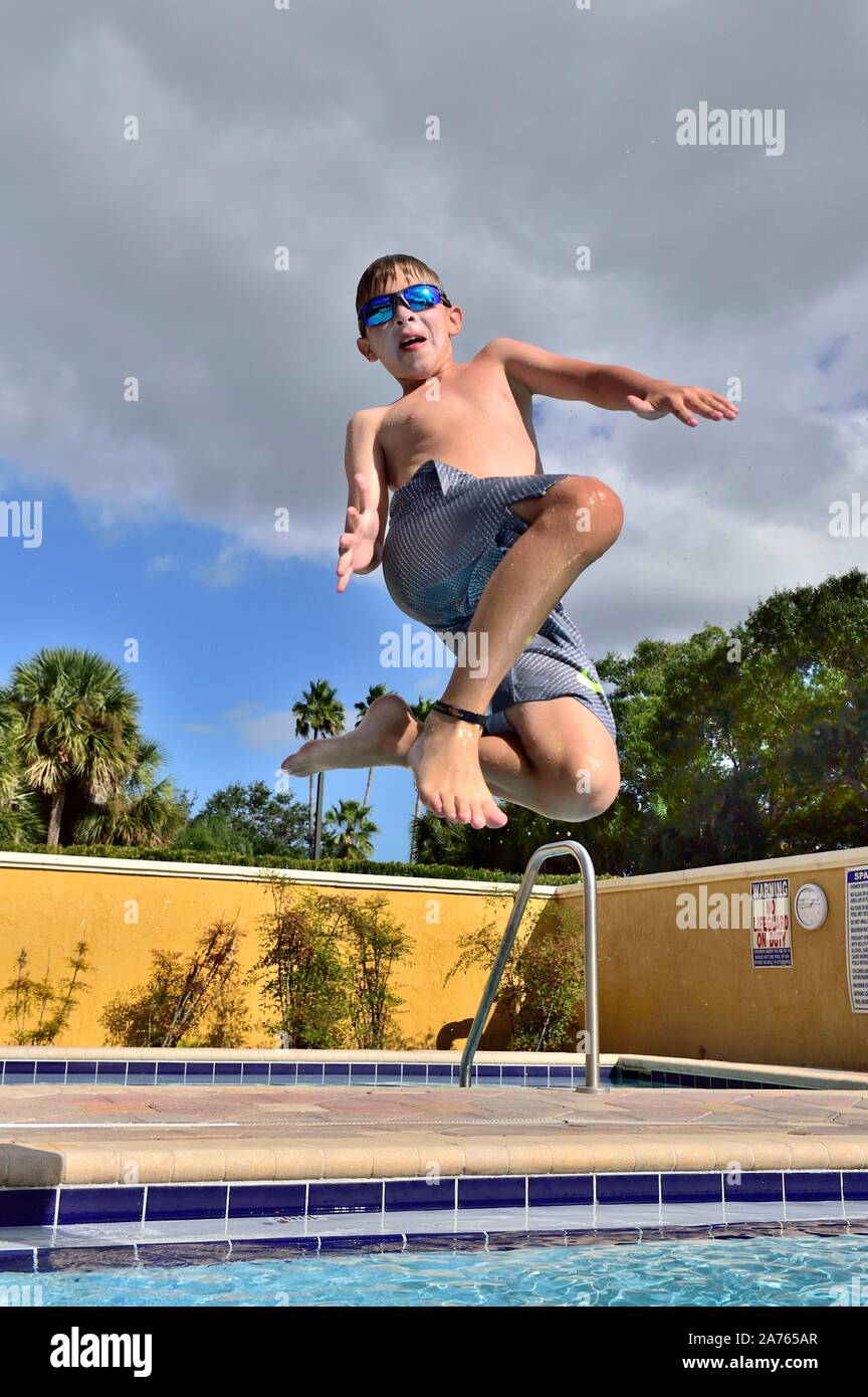 Boy jumps water hi-res stock photography and images - Alamy