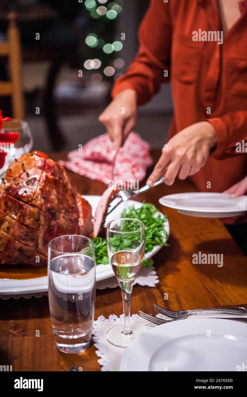 Woman cutting ham on hi-res stock photography and images - Alamy