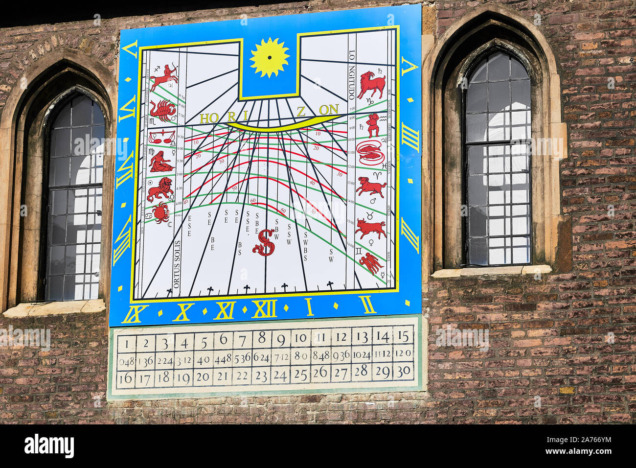 Sundial and moondial on a wall in the Old Court at Queens' college ...