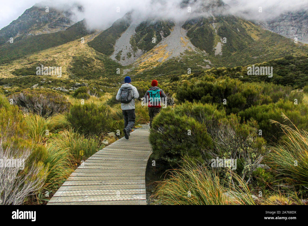 Two men walking on white hi-res stock photography and images - Alamy