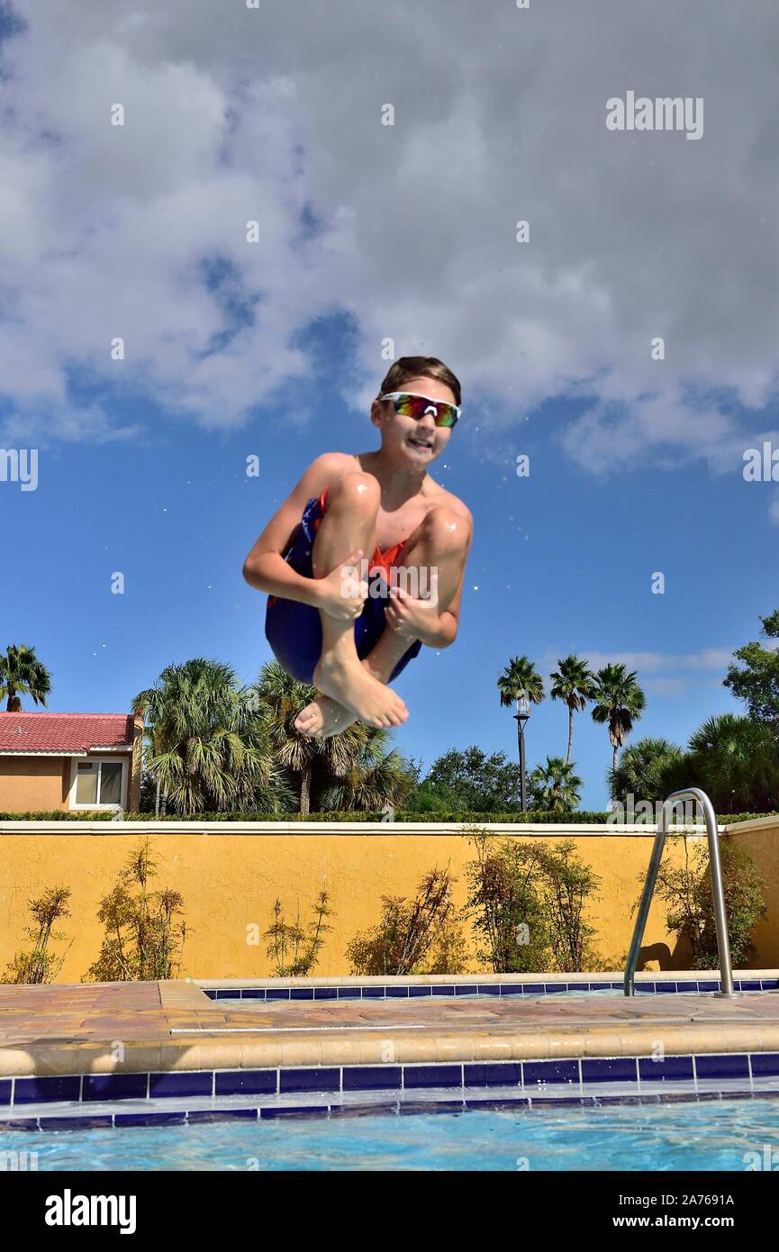 Boy jumps water hi-res stock photography and images - Alamy