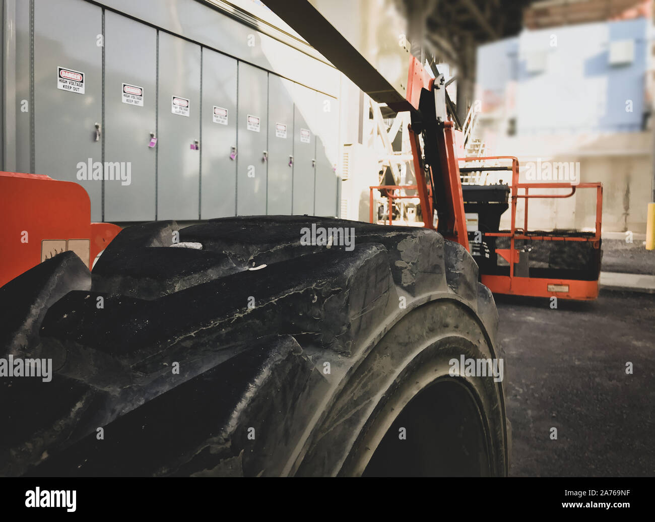 Articulating boom lift in the work industry area Stock Photo - Alamy