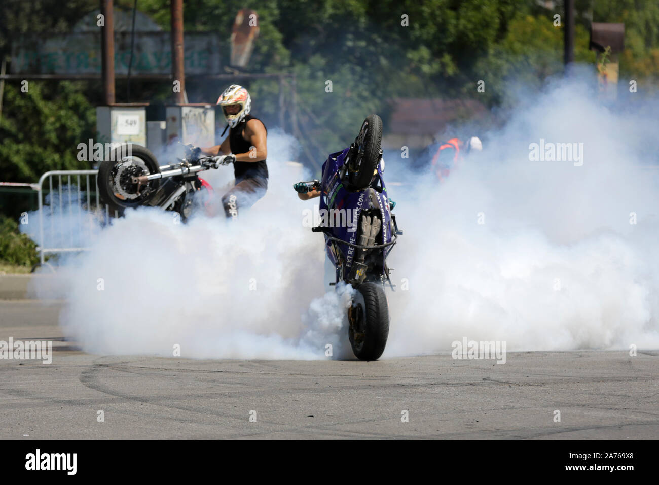 Sofia, Bulgaria - 18 August 2019: Two motorbikes burn wheels on a race ...