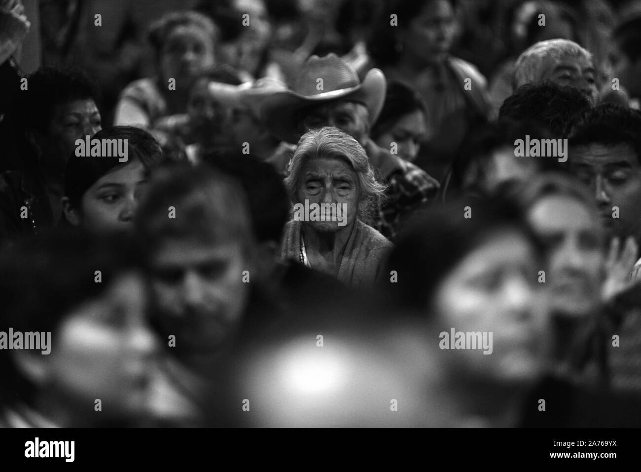 Black and white photo of an old humble woman with closed eyes ...
