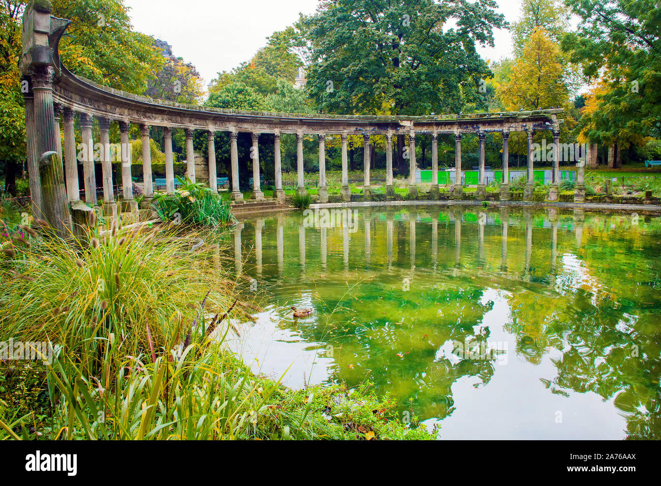 pseudo ancient arch with columns and pond. Monceau park. Duck in pond ...