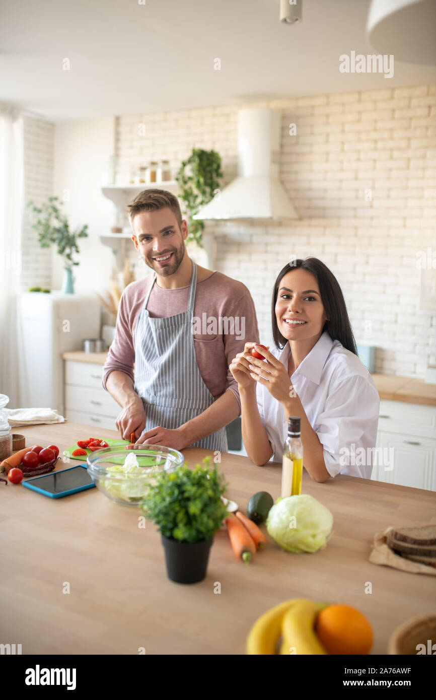 Couple feeling joyful while cooking breakfast together Stock Photo - Alamy