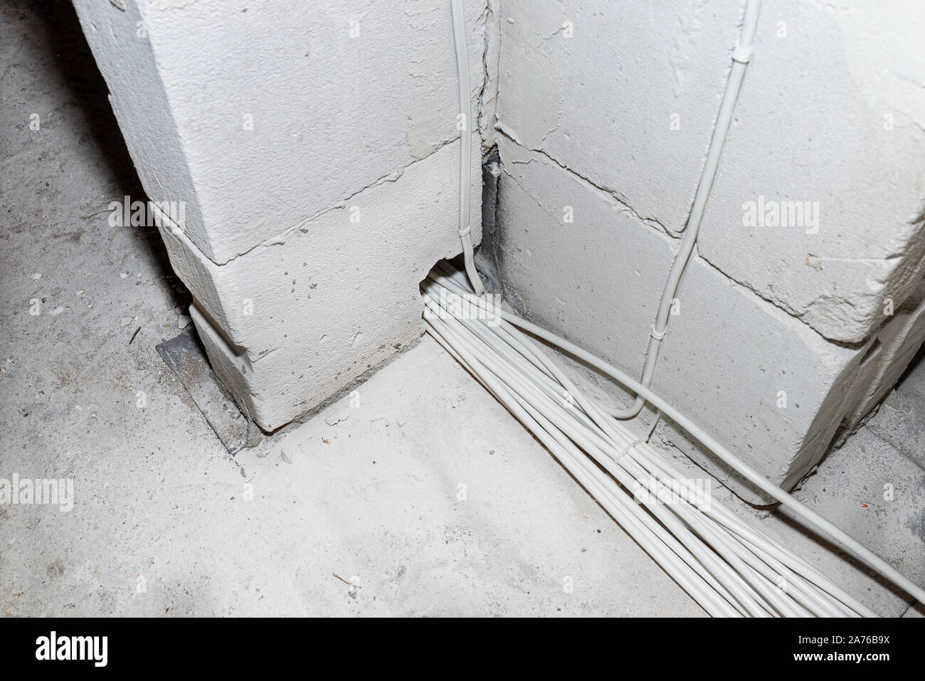 Layed installation of electric cables on the floor in a newly built ...