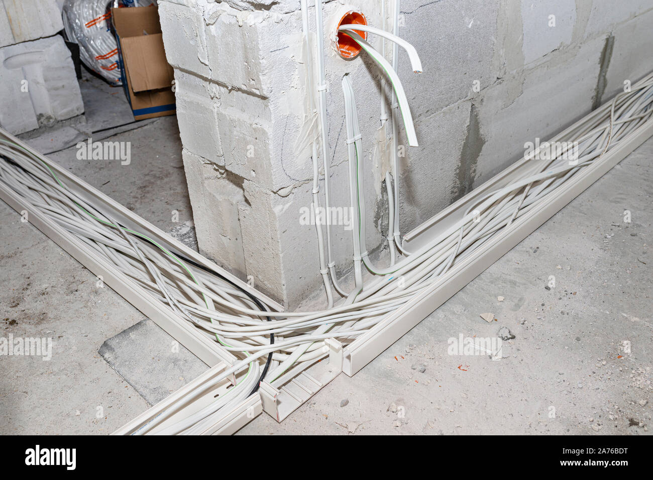 Layed installation of electric cables on the floor in a newly built ...