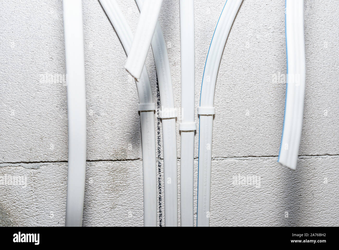 Home electrical installation cables attached to the wall Stock Photo ...