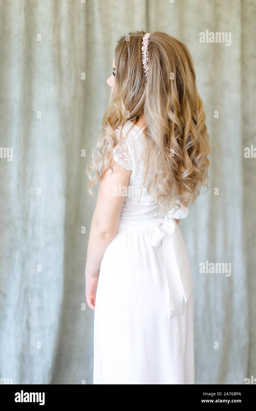 Back view of blonde bride at photo studio Stock Photo - Alamy