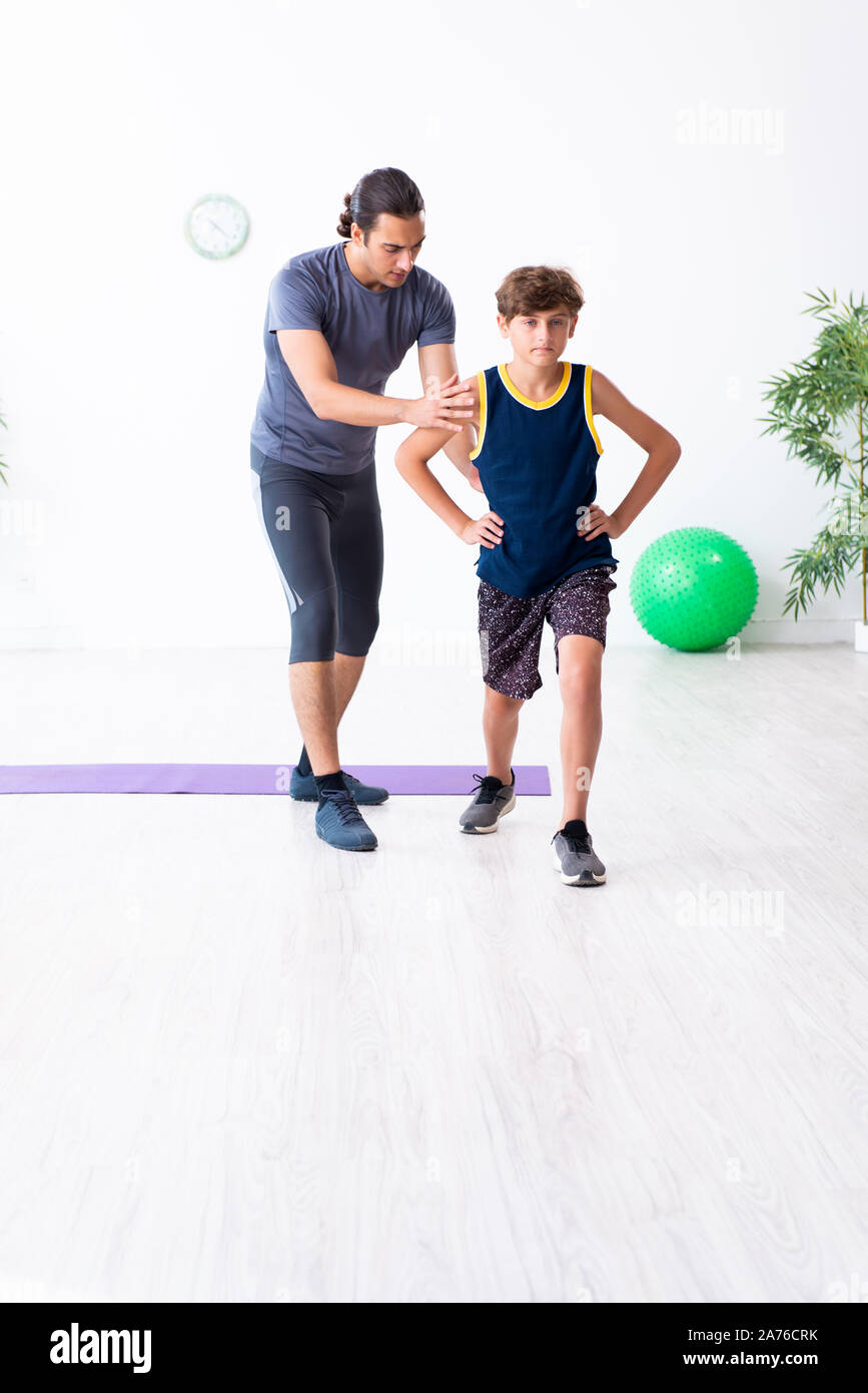 The young father and his son doing exercises Stock Photo - Alamy