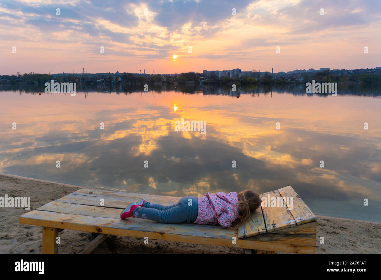 Woman lying down beach chair hi-res stock photography and images - Alamy