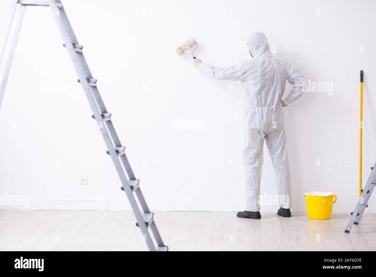 Painter working at the construction site Stock Photo - Alamy