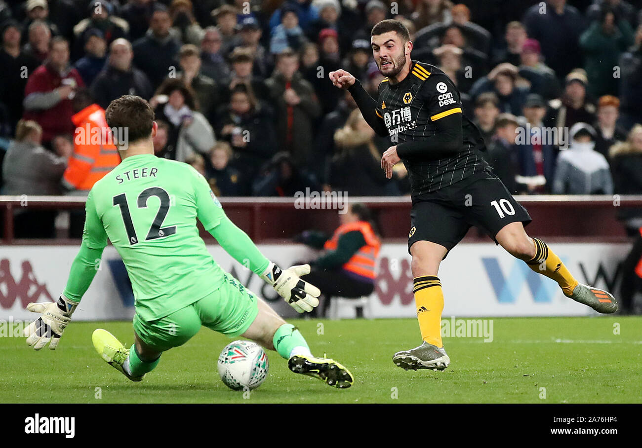 Aston Villa goalkeeper Jed Steer (left) saves a shot from Wolverhampton ...