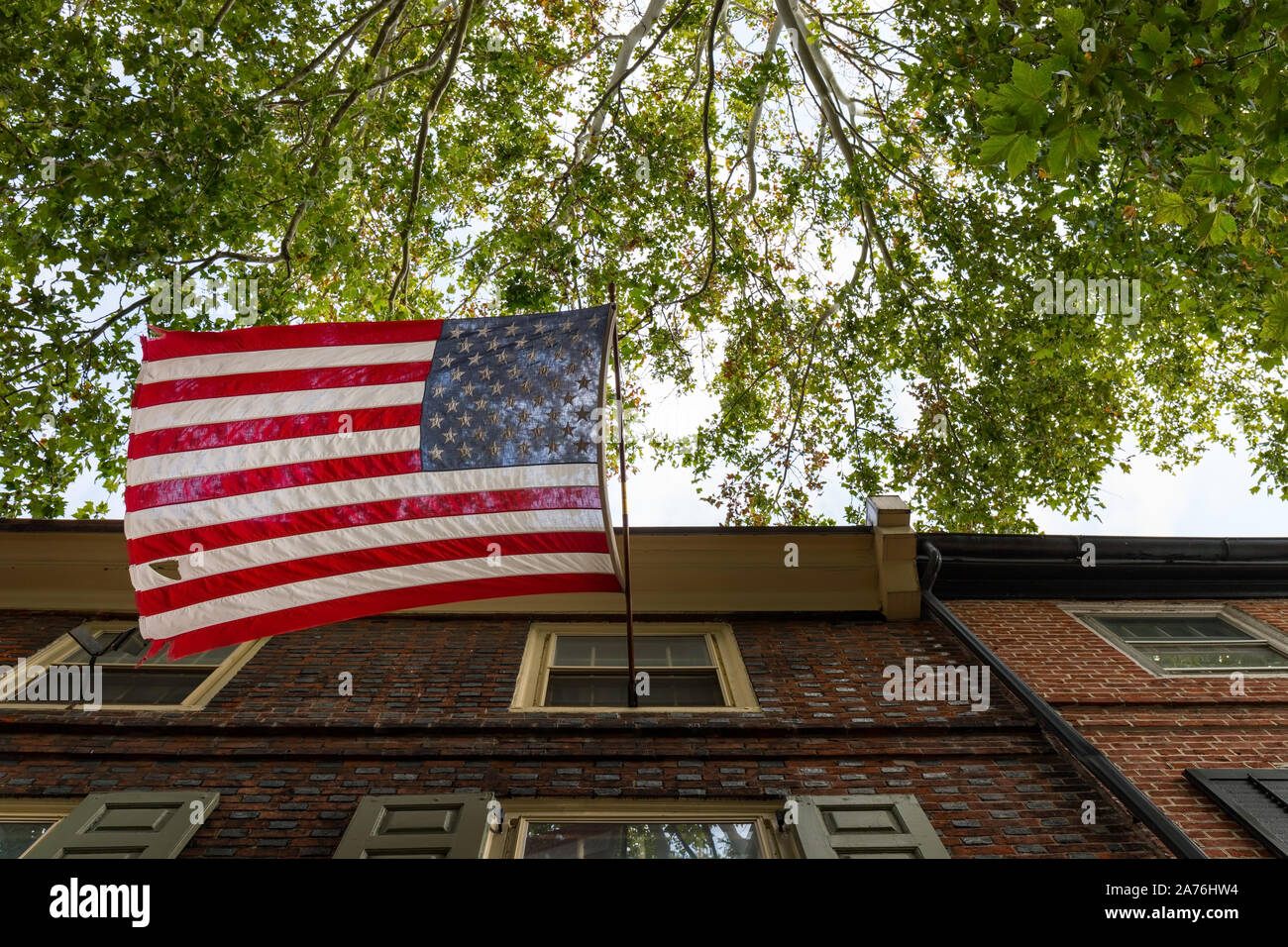 American flag hanging from building hi-res stock photography and images ...