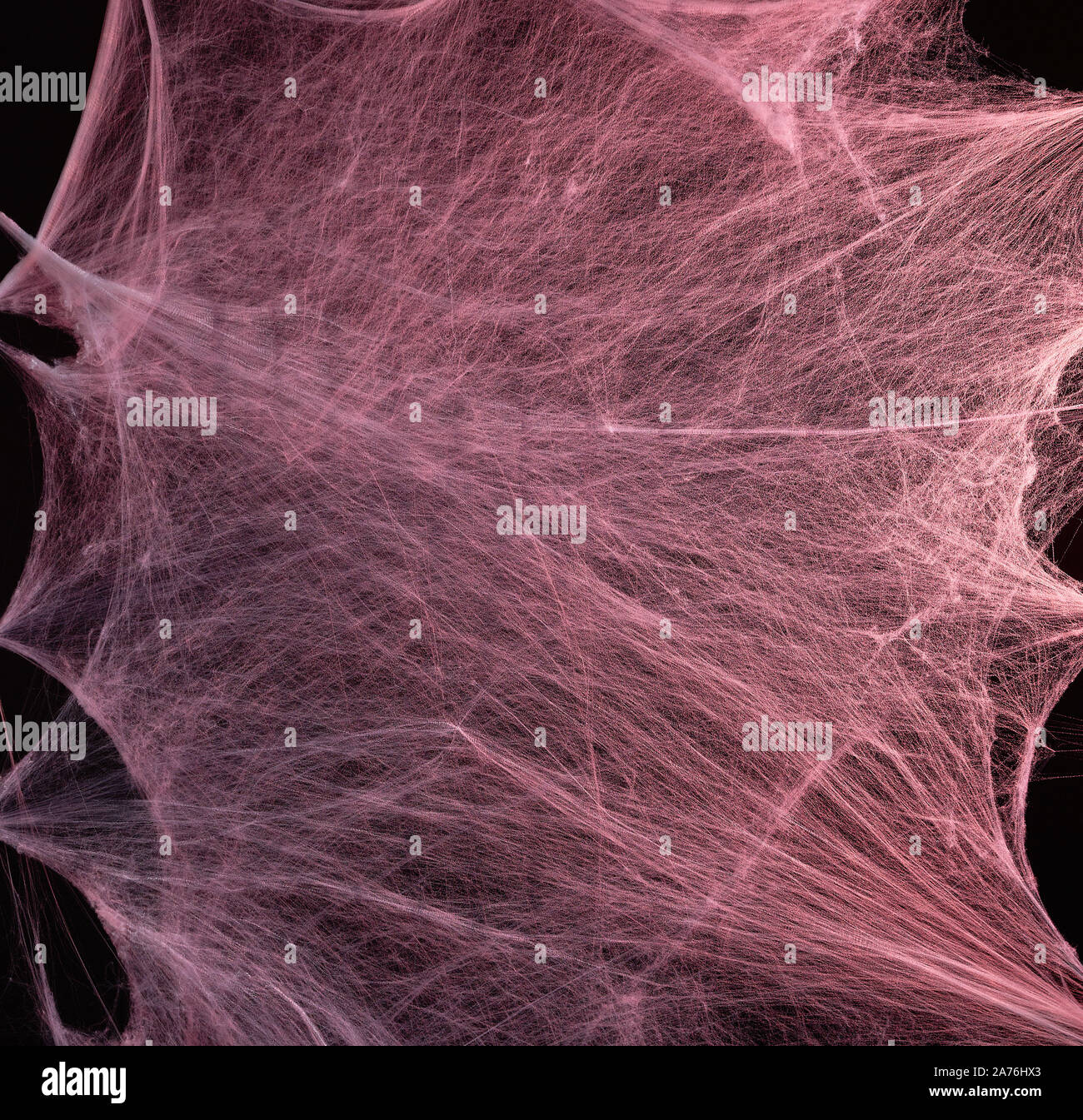 stretched white web with red backlight, background for the holiday ...