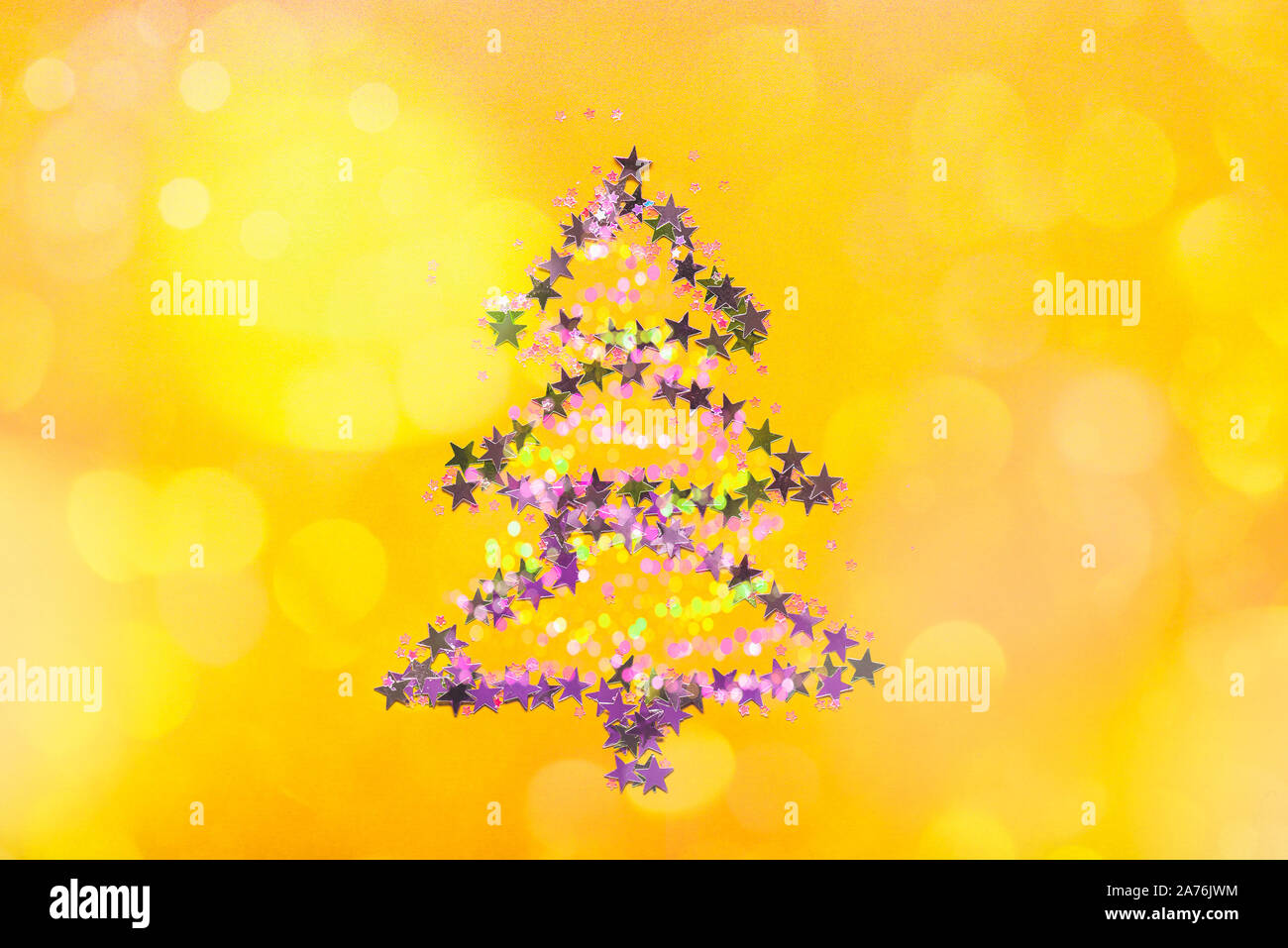 Christmas Tree made from stars on bright yellow background Stock Photo ...