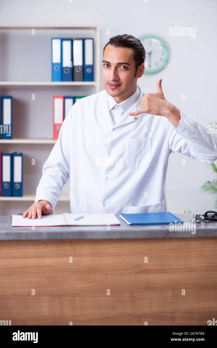 Male receptionist notes hi-res stock photography and images - Alamy