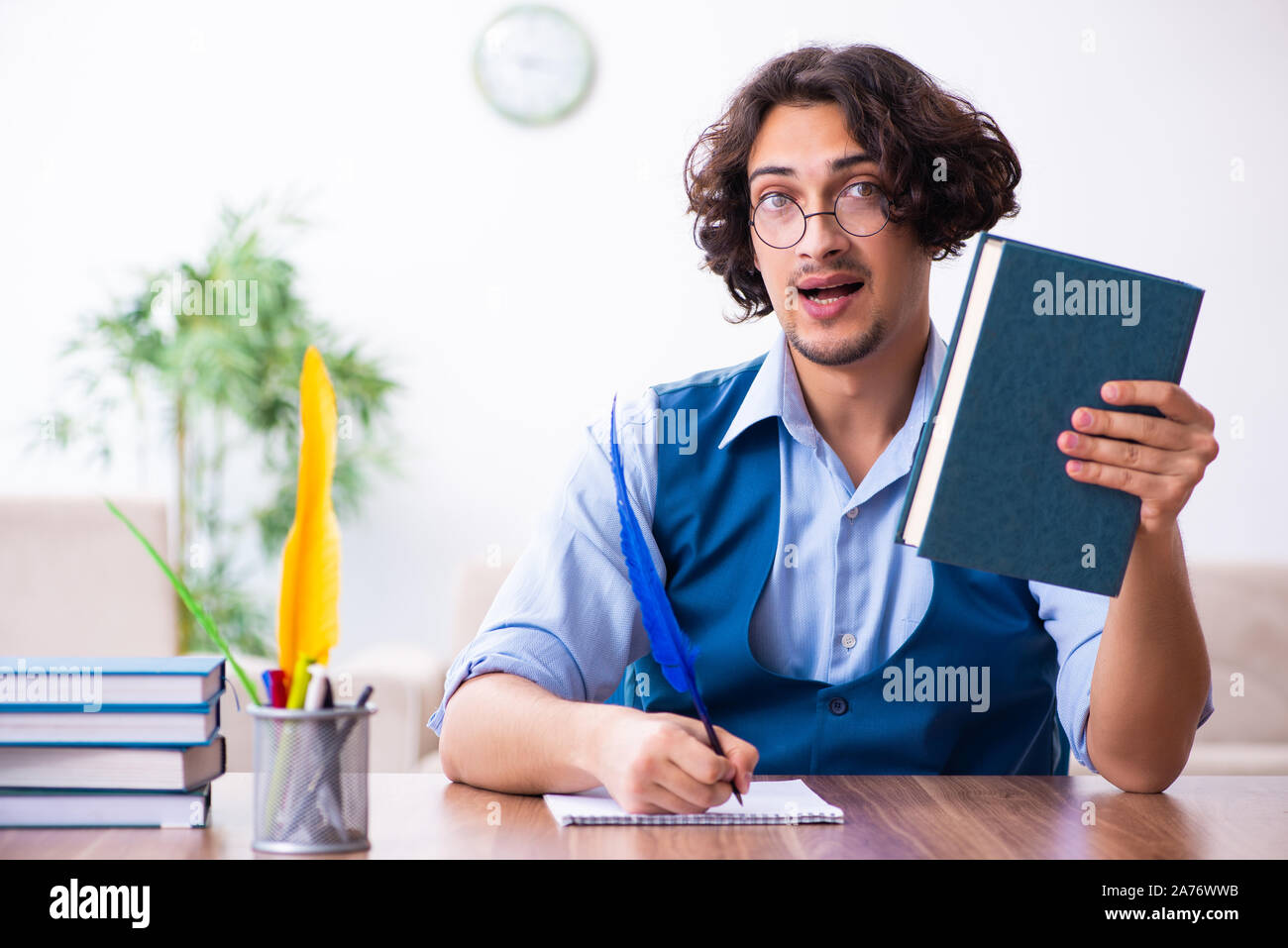 The young writer working on his new work Stock Photo - Alamy