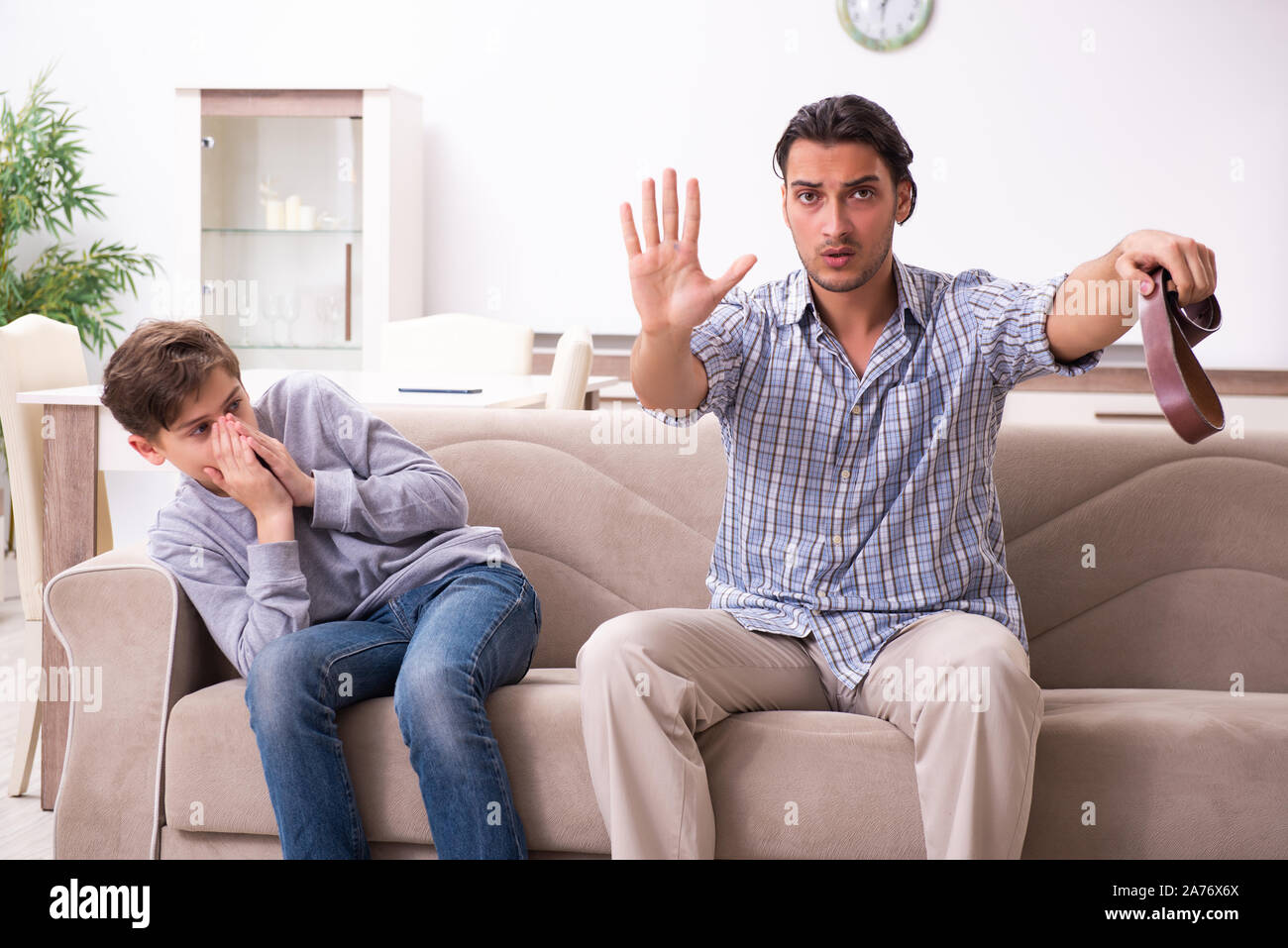 The father beating and punishing his sone Stock Photo - Alamy