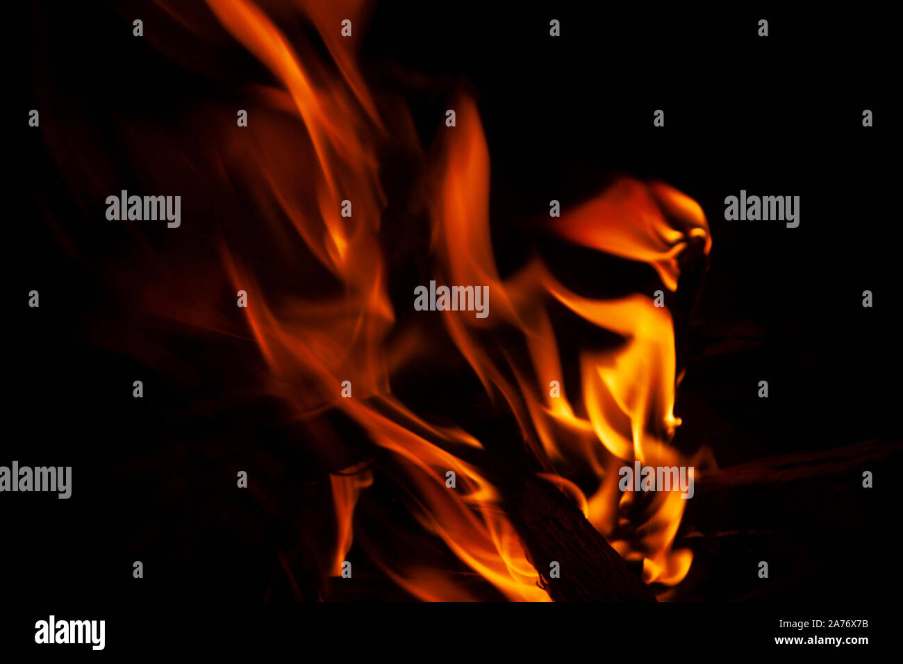 Abstract graphic wind blowing red flames on black background photo shot ...