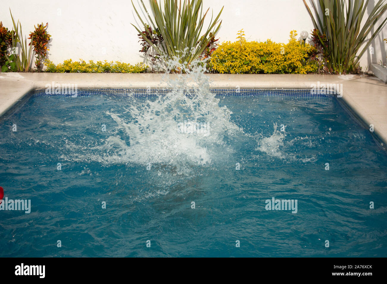 Splash in blue water photograph taken with daylight in Cocoyoc Morelos ...