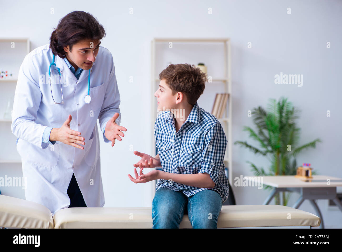 Teen boy doctor consultation clinic hi-res stock photography and images ...
