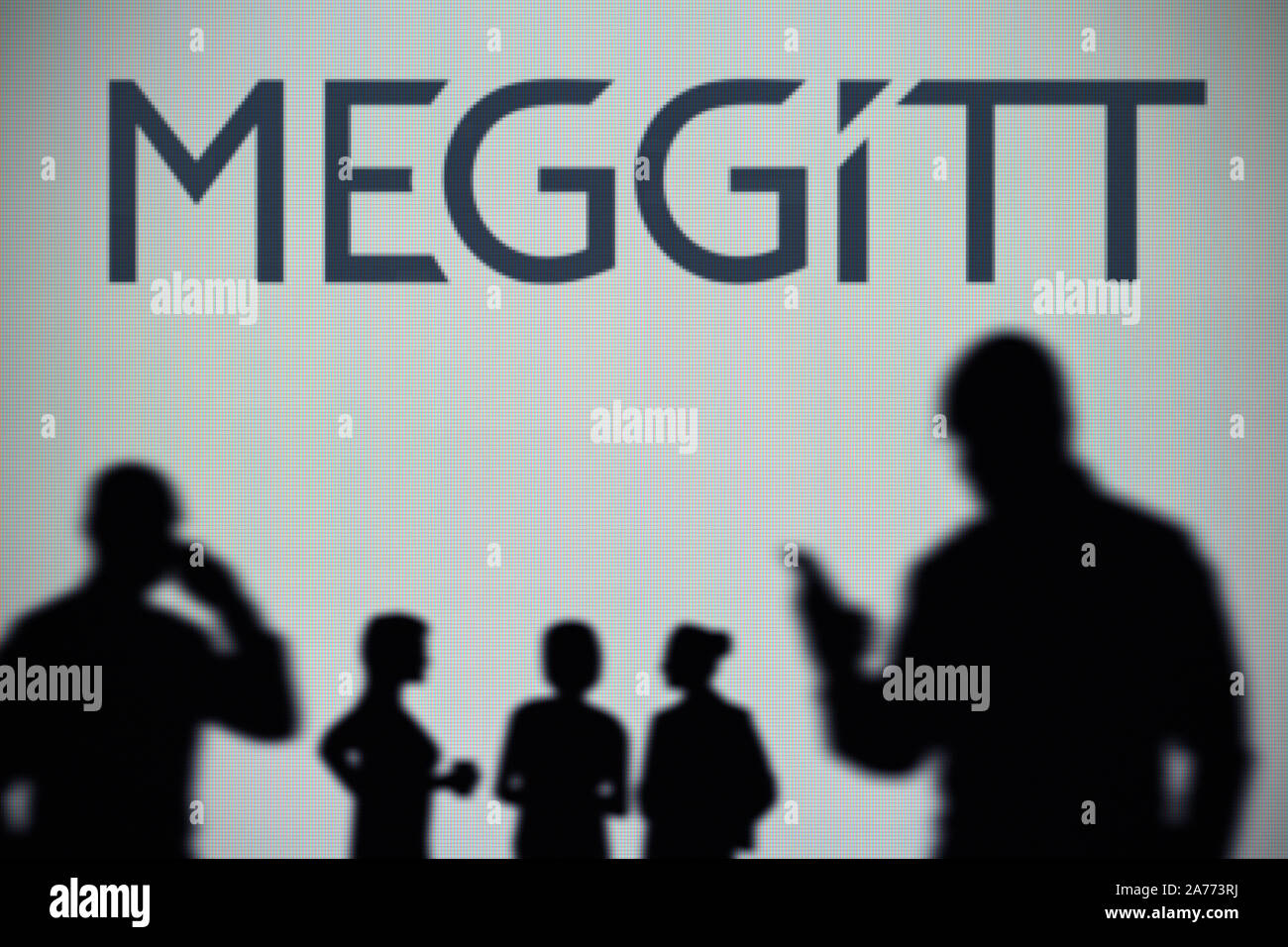 The Meggitt plc logo is seen on an LED screen in the background while a ...