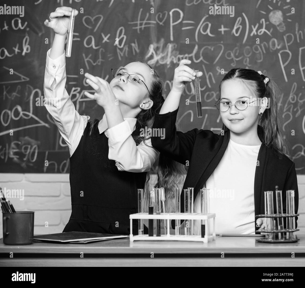 Happy children. Biology lesson. students doing biology experiments with ...