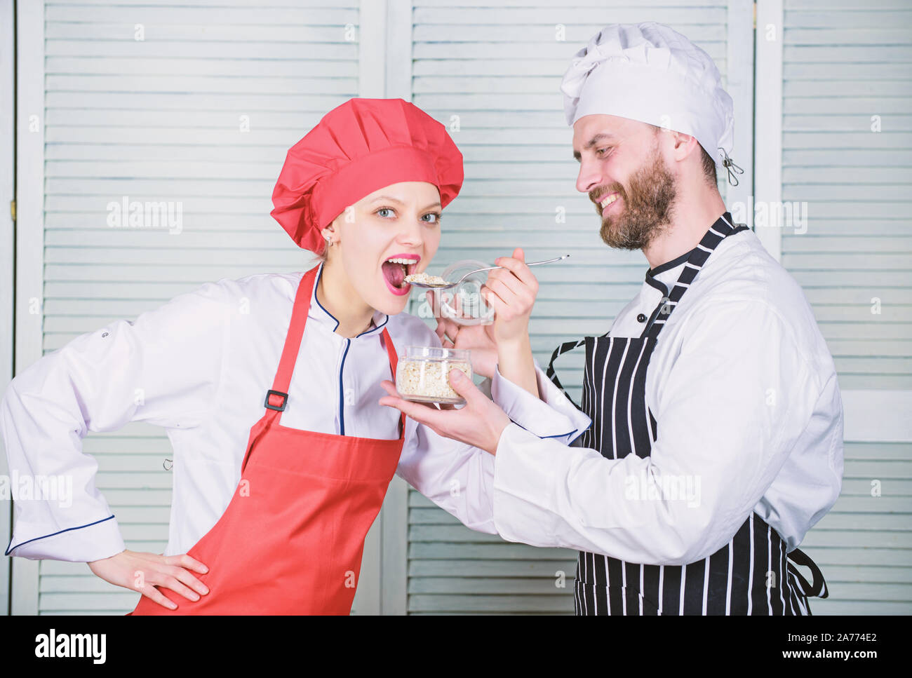 Happy married couple have joy together at kitchen. secret ingredient by ...