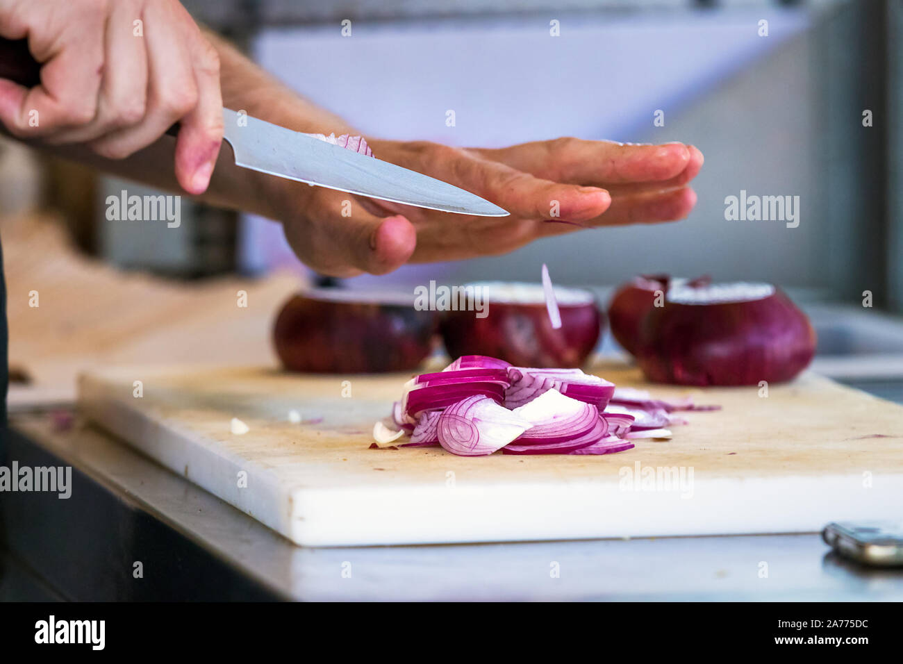 Hand chopping onions hi-res stock photography and images - Alamy