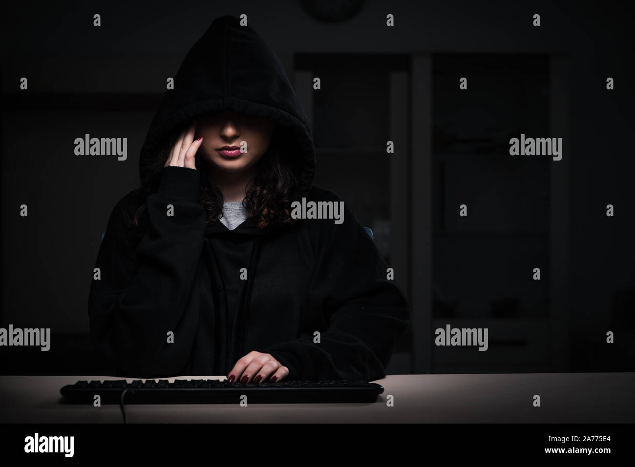 The female hacker hacking security firewall late in office Stock Photo ...