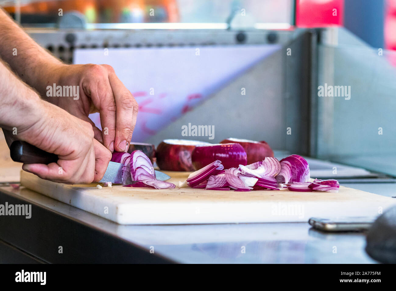 Hand chopping onions hi-res stock photography and images - Alamy