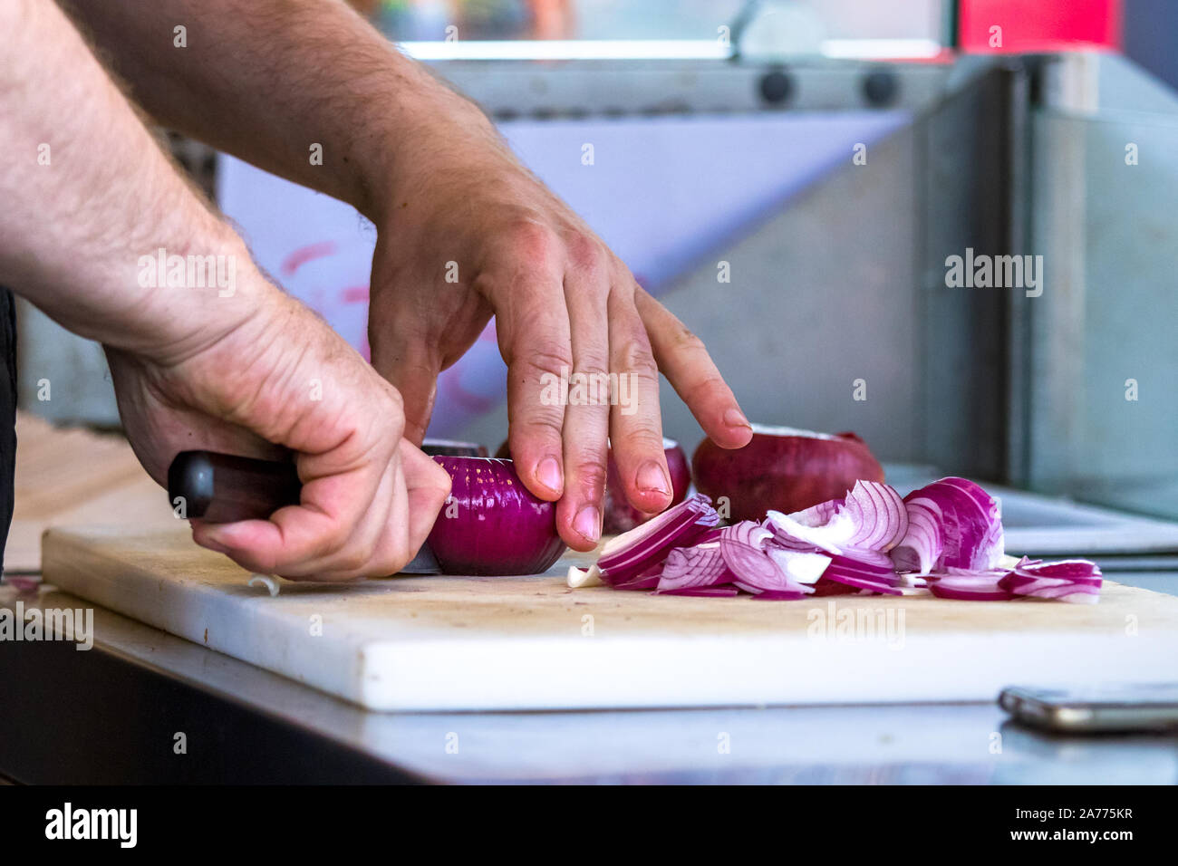 Hand chopping onions hi-res stock photography and images - Alamy