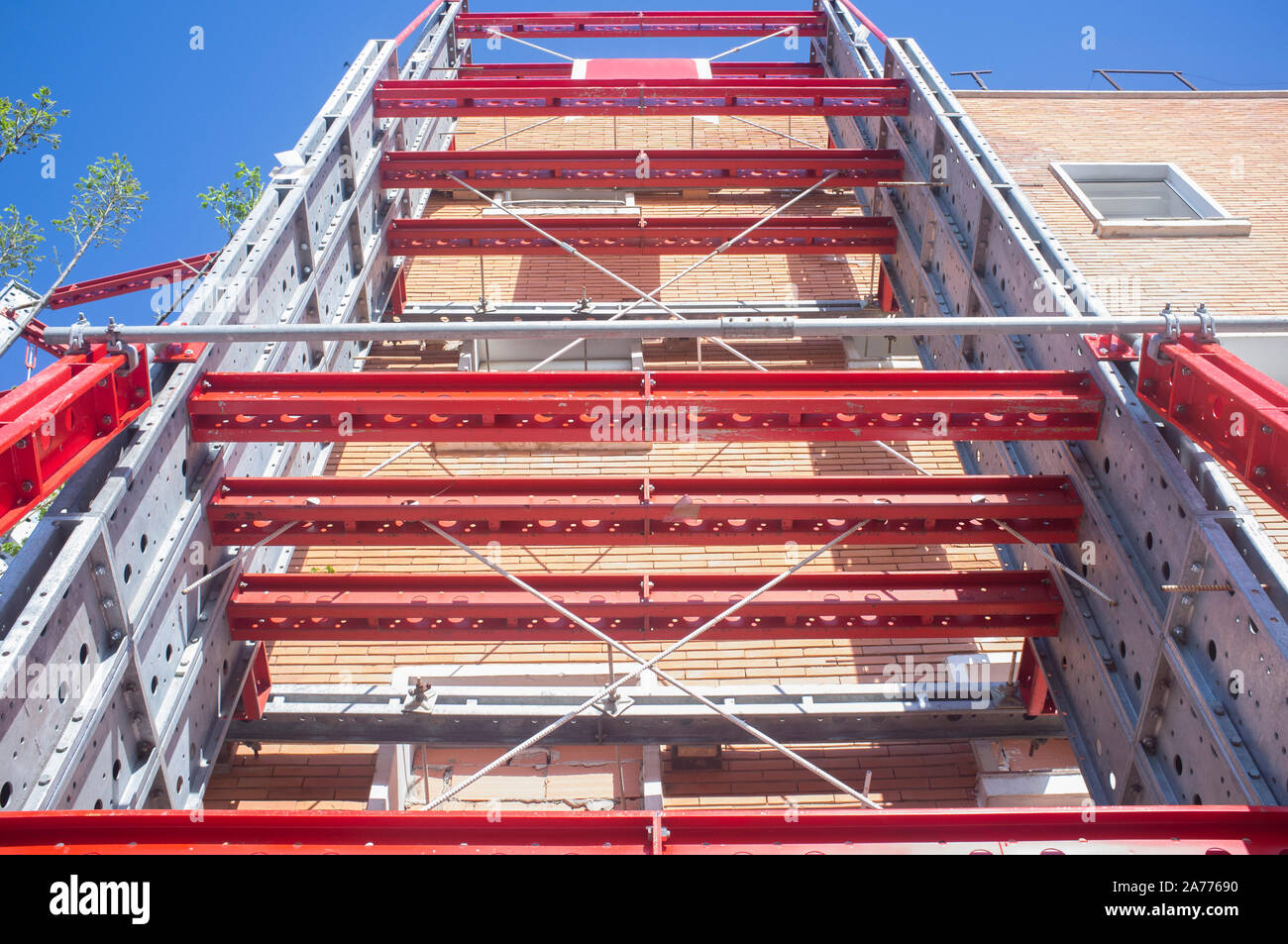 Reinforced building with structural bracing on facade. Steel girders ...