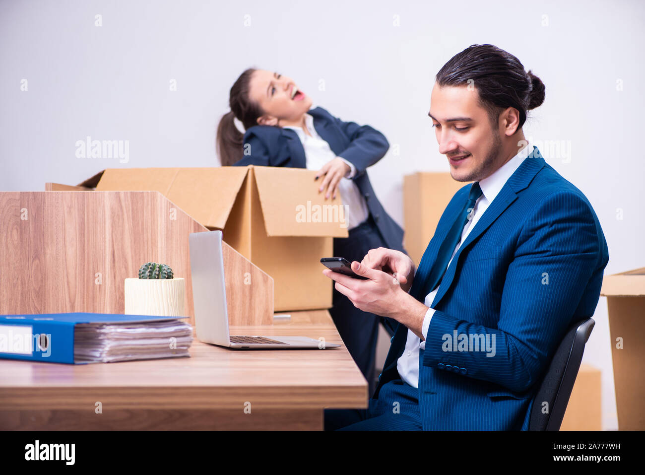 The two employees being fired from their work Stock Photo - Alamy