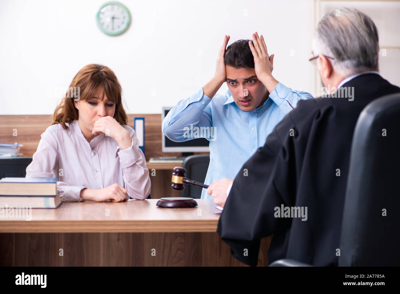 The young couple in the courthouse in divorce concept Stock Photo - Alamy