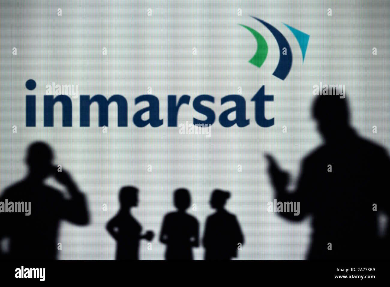 The Inmarsat logo is seen on an LED screen in the background while a ...