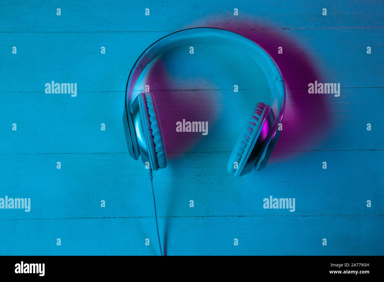 Top view of set of gadgets in purple neon light and blue background ...