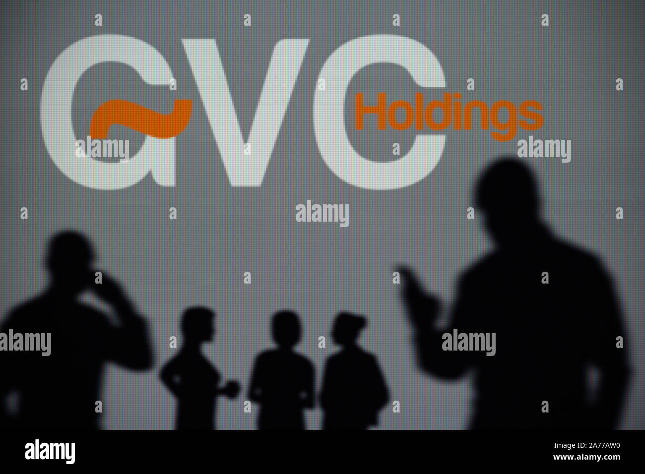 The GVC Holdings logo is seen on an LED screen in the background while ...