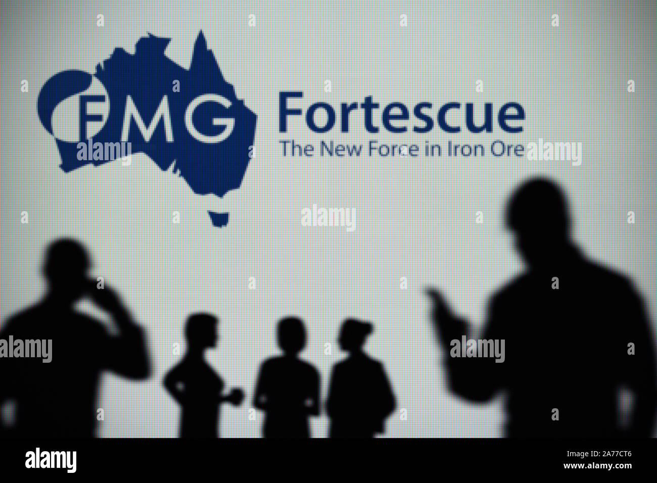 The Fortescue logo is seen on an LED screen in the background while a ...