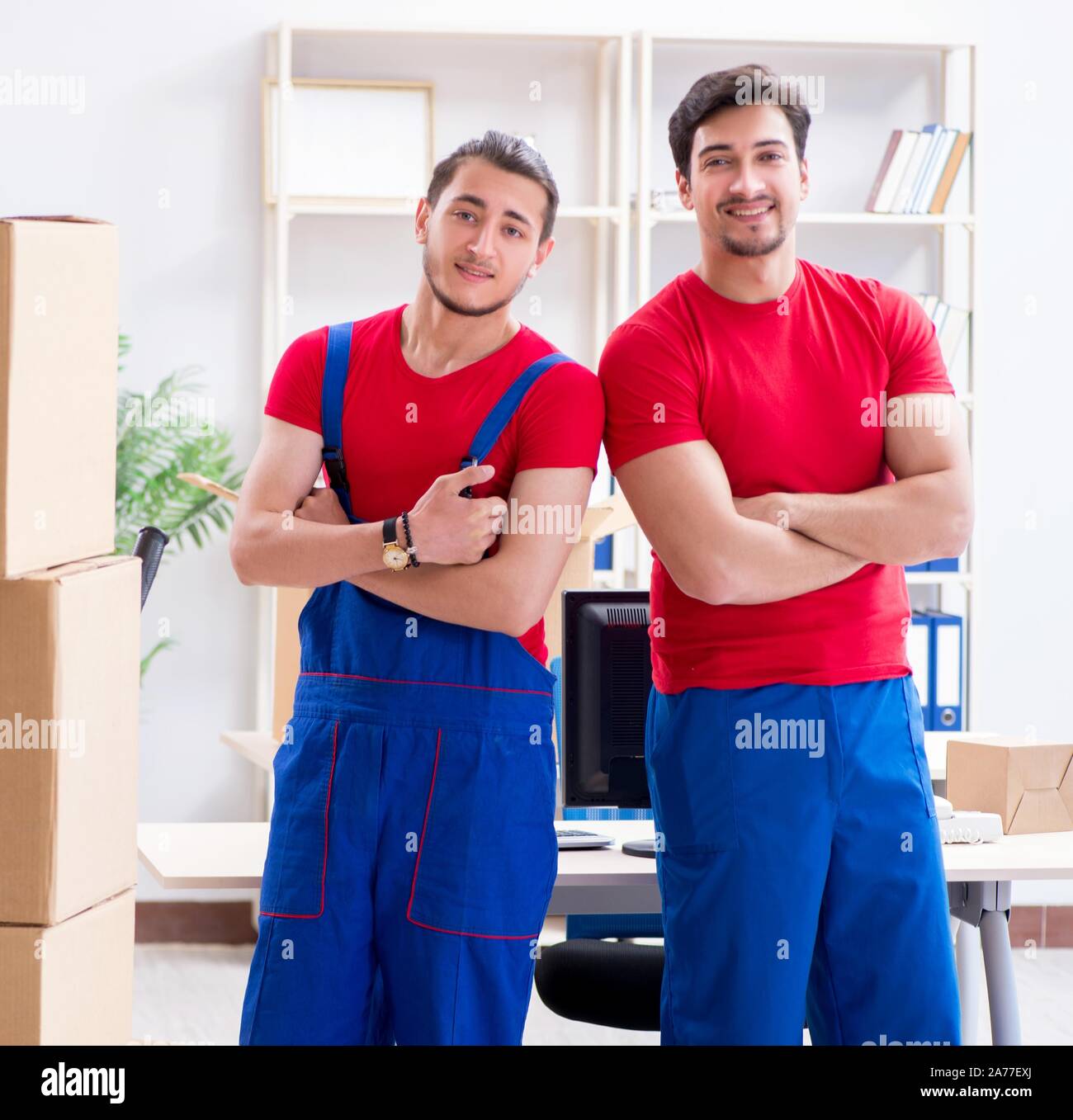 The two contractor employees moving personal belongings Stock Photo - Alamy