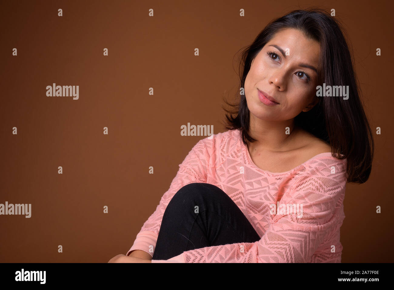 Mid adult woman sitting on floor hi-res stock photography and images ...