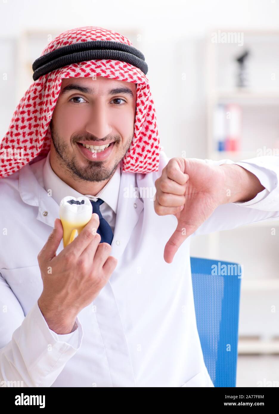 The arab dentist working on new teeth implant Stock Photo - Alamy
