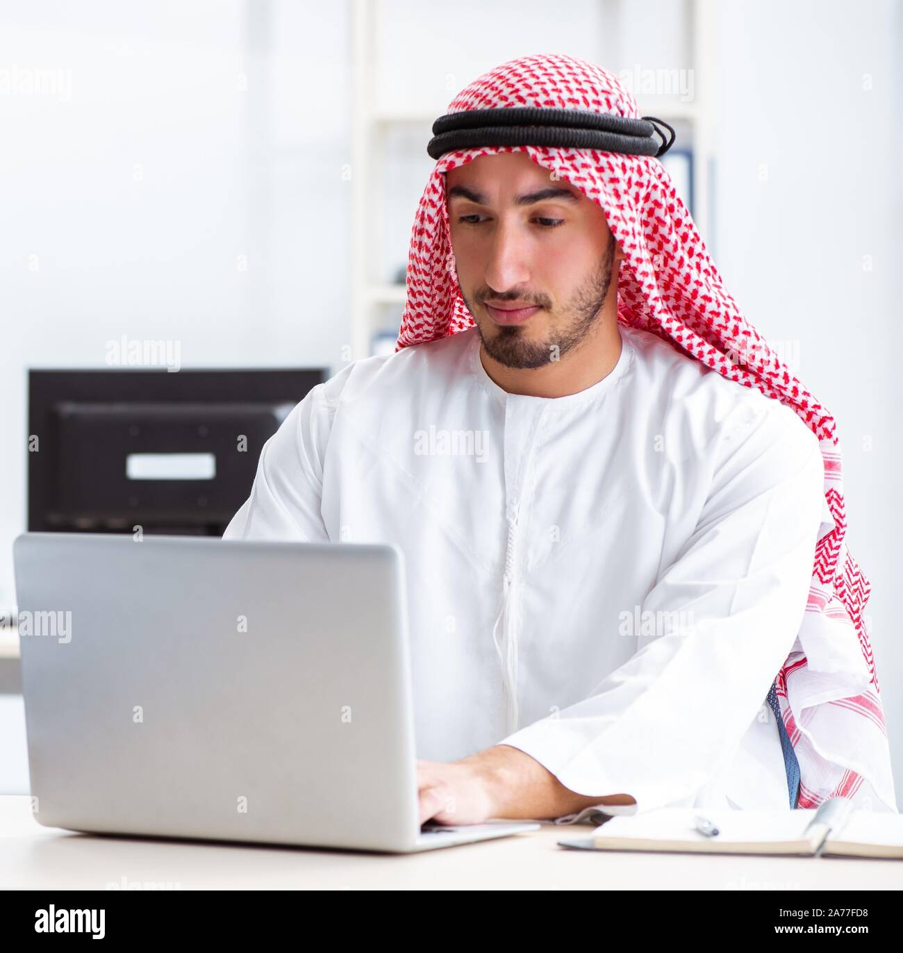 The arab businessman working in the office Stock Photo - Alamy