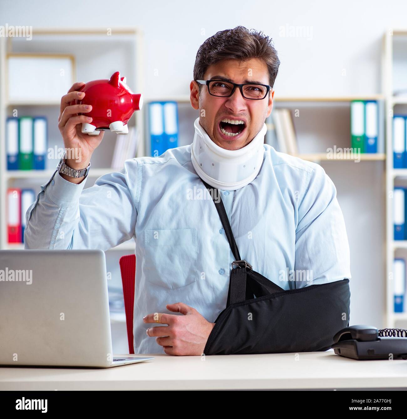 The businessman with broken arm working in office Stock Photo - Alamy