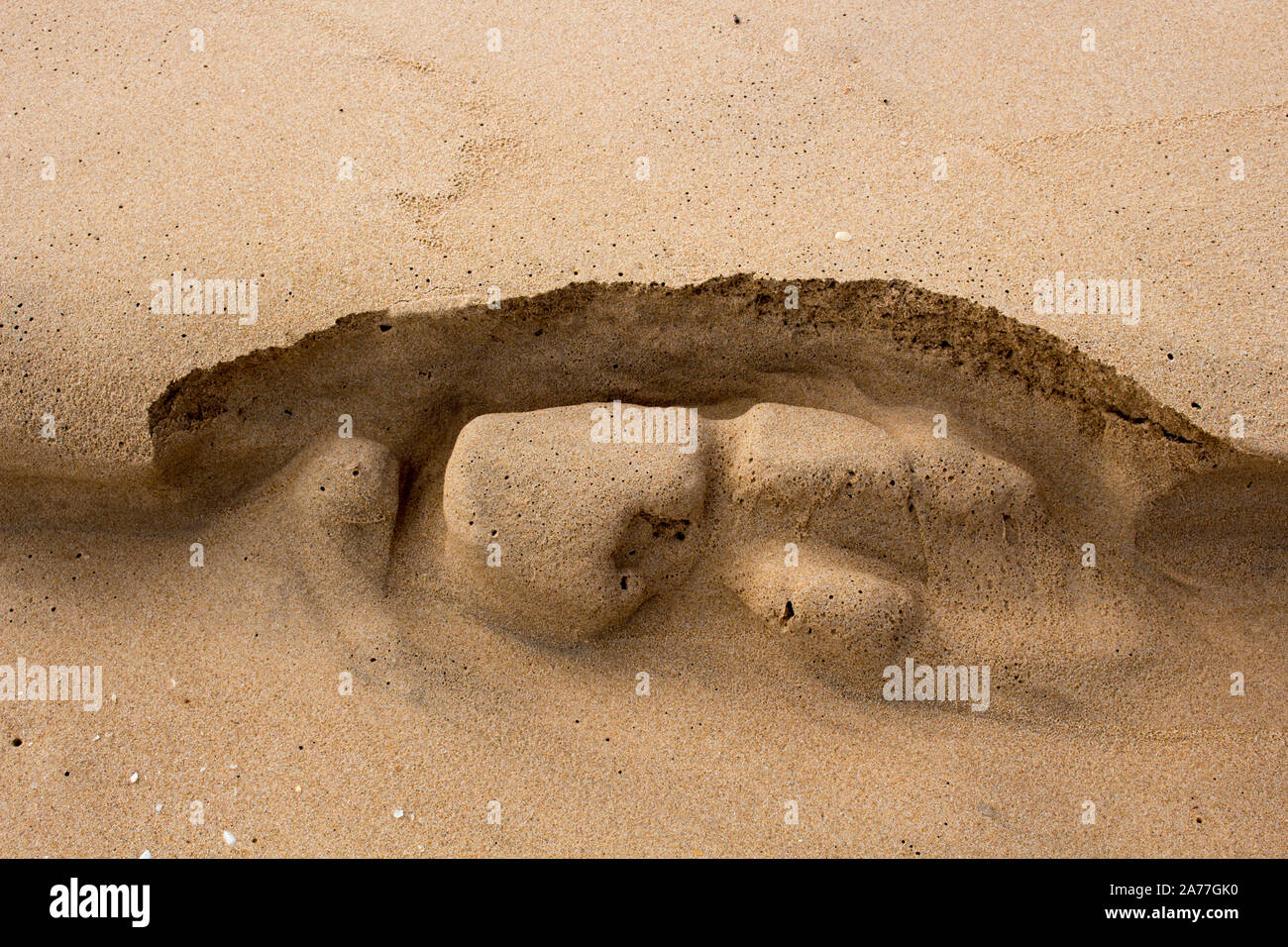 Sand patterns formations where Indian Ocean waves are lapping the sandy ...