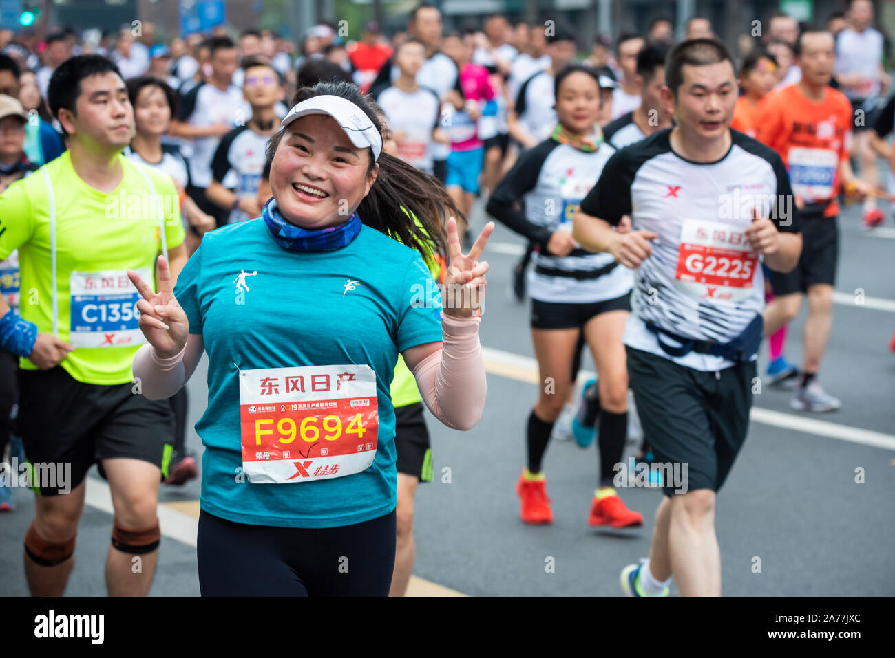 Chengdu, Sichuan province, China - Oct 27, 2019 : Young woman running ...