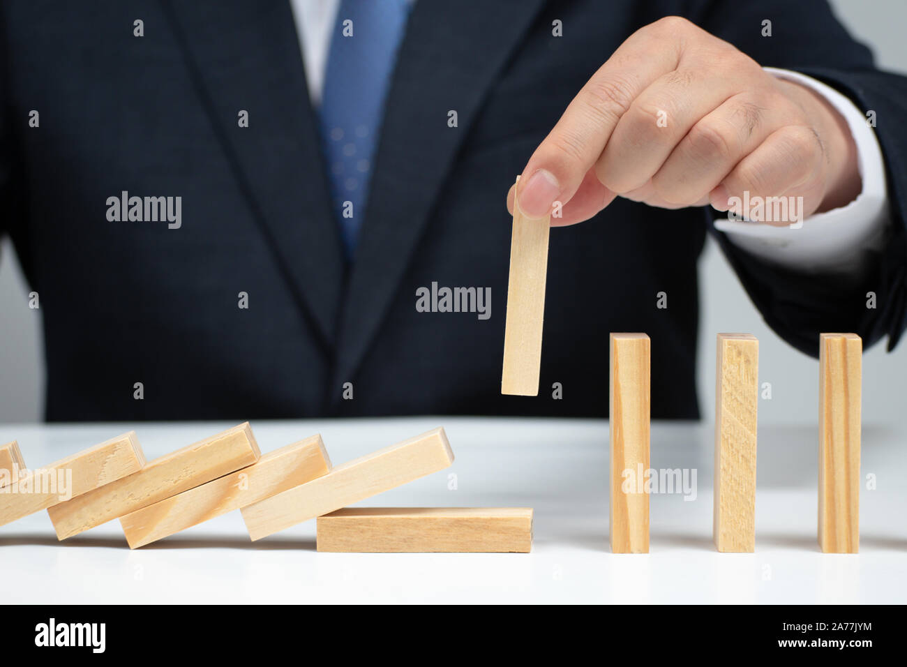 Domino effect control hi-res stock photography and images - Alamy